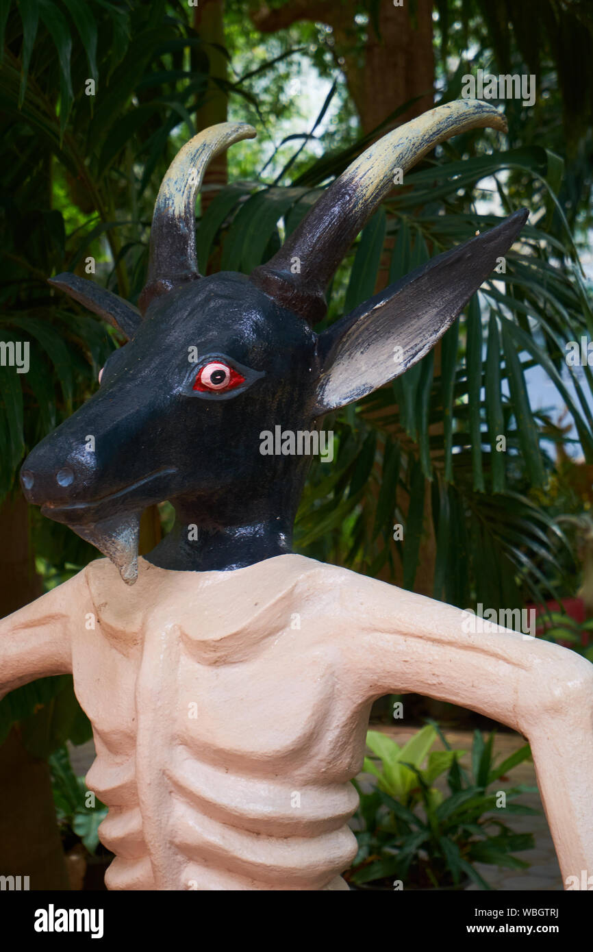 A person turned into a black goat in the Hell Garden at Wat Muang in ...