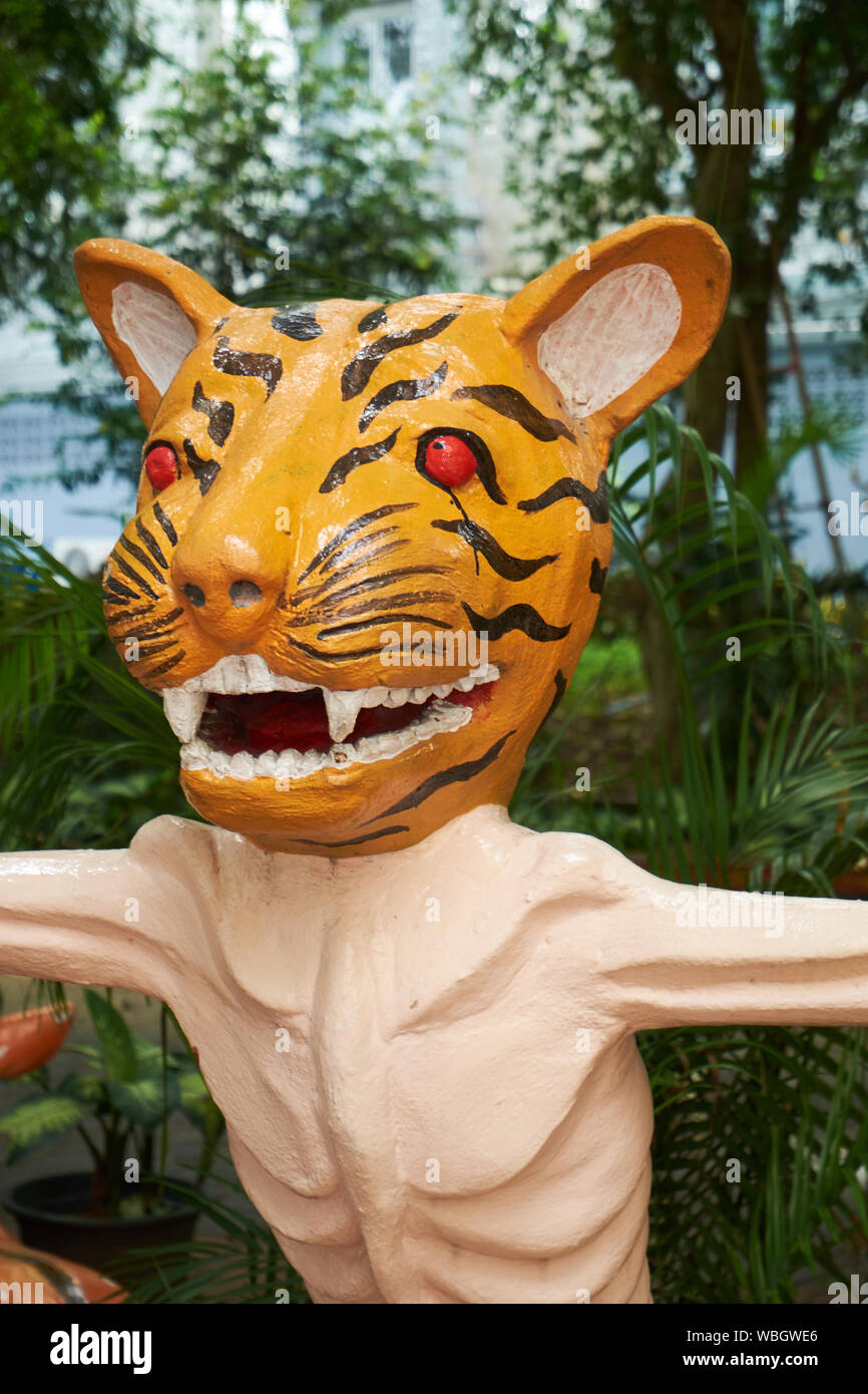 A person turned into a orange tiger in the Hell Garden at Wat Muang in ...