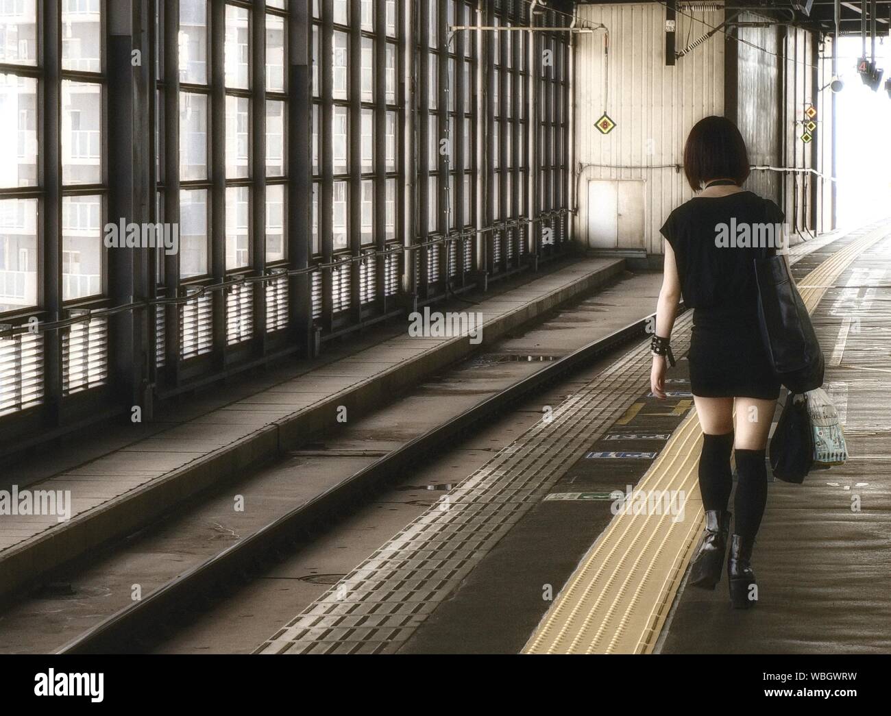 Woman walking on platform hi-res stock photography and images - Alamy