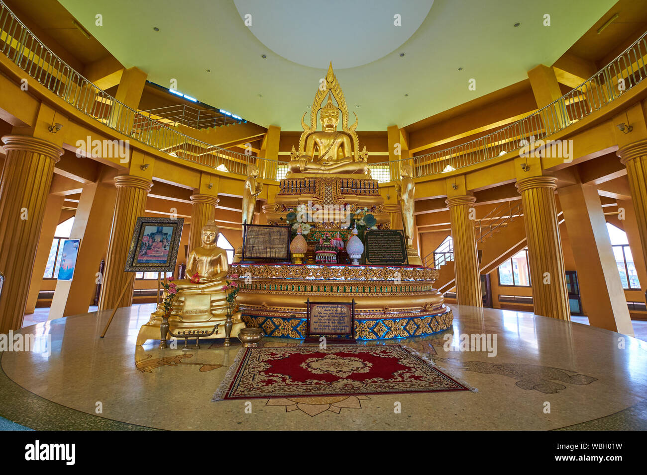 Buddha statue on one of the levels in the main pyramid tower at Wat Tha ...