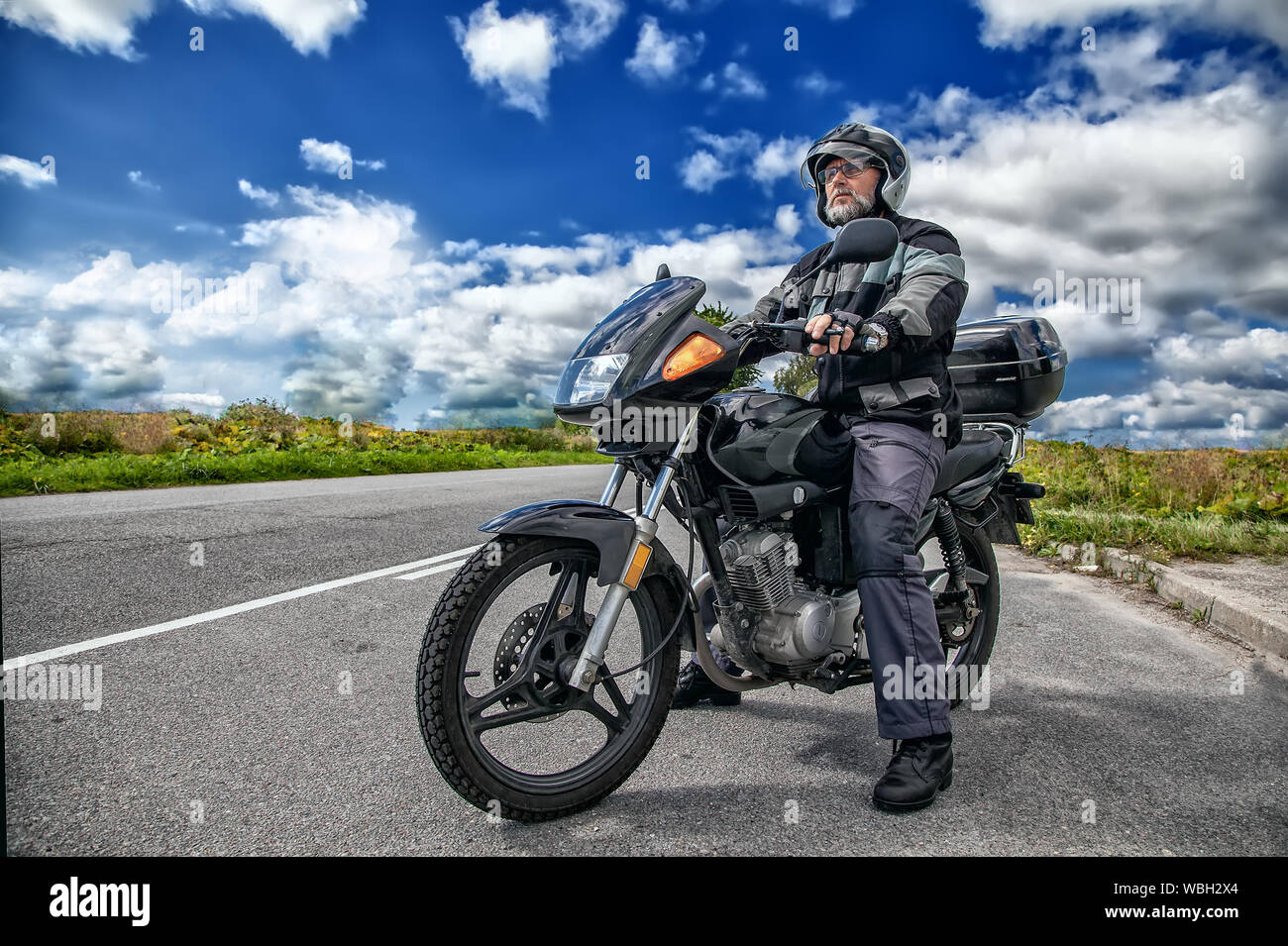 Elderly man sitting on motorcycle hi-res stock photography and images ...