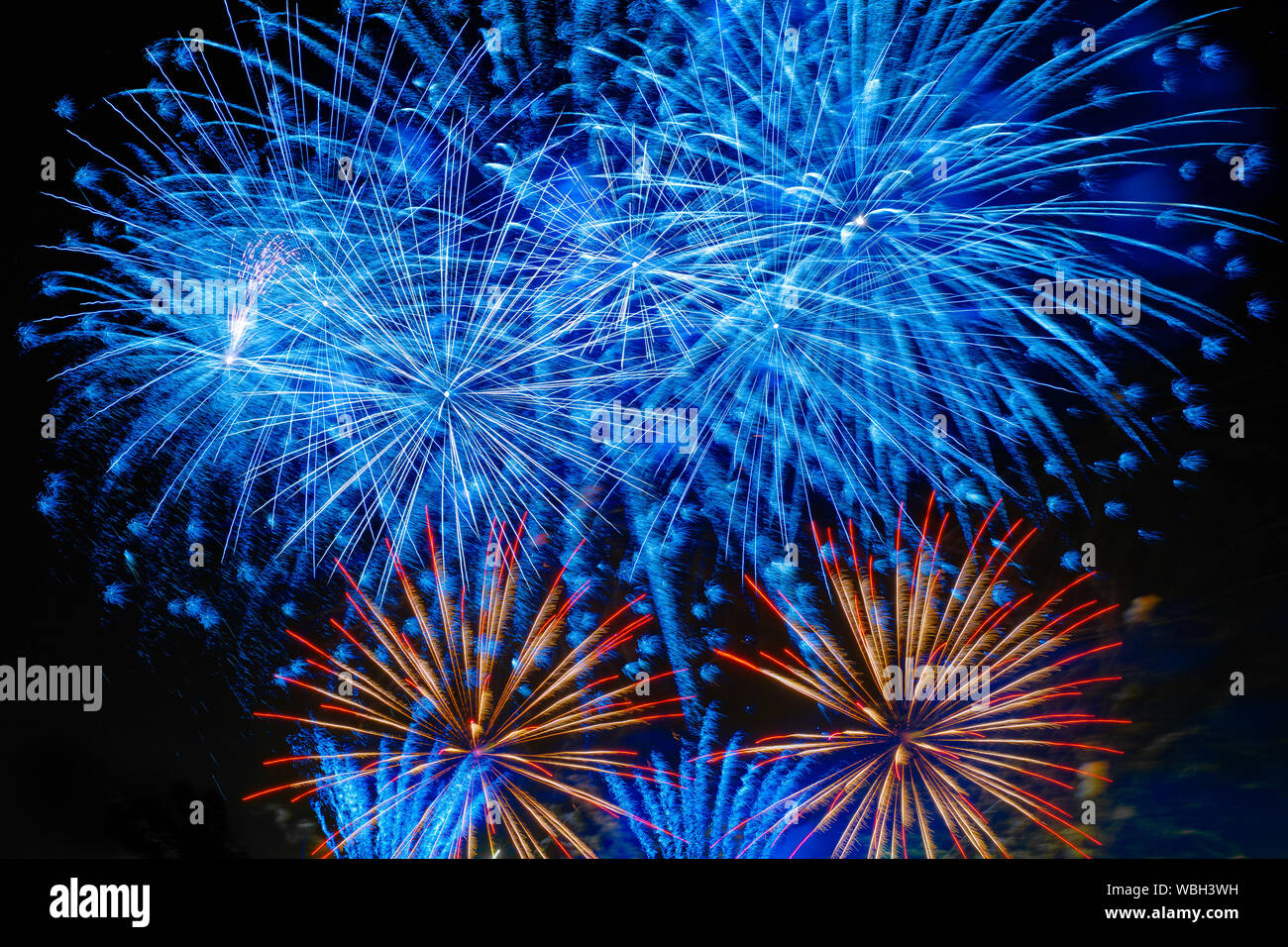 Colorful fireworks in night sky background Stock Photo - Alamy