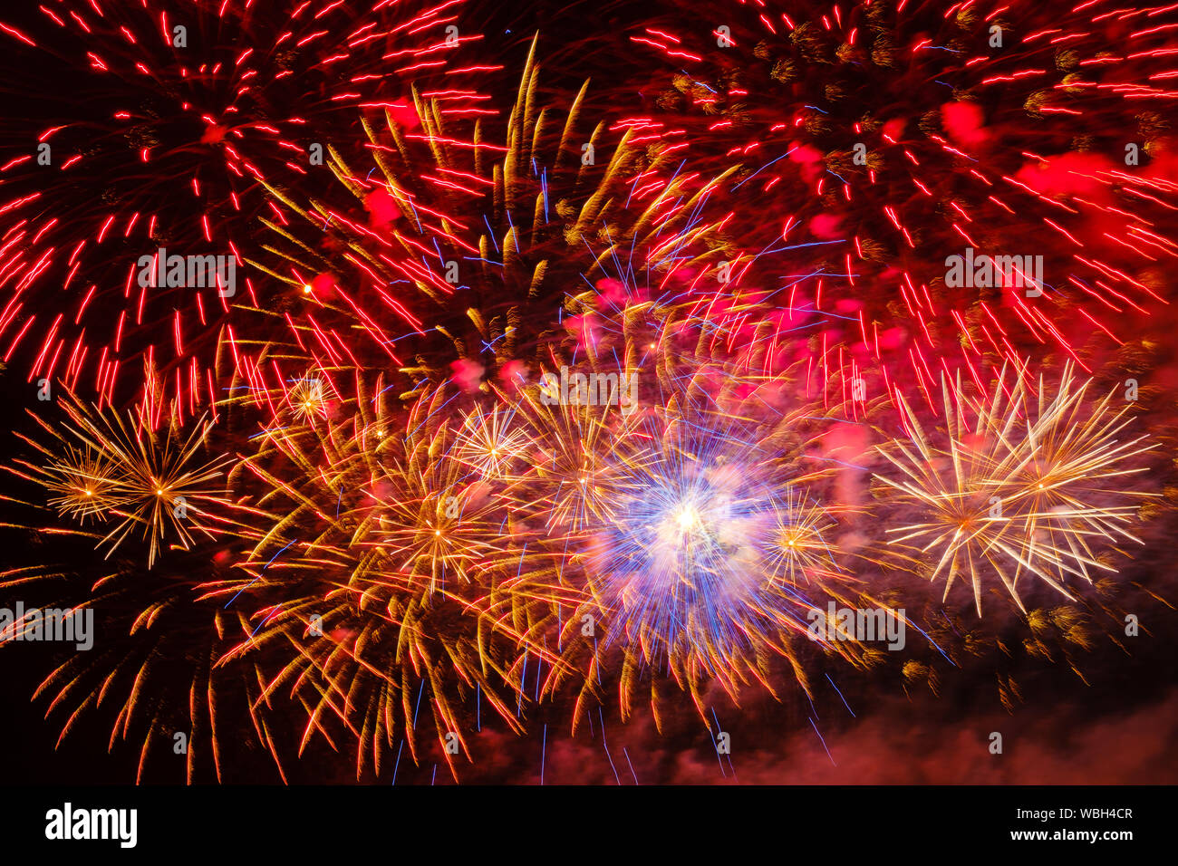 Colorful fireworks in night sky background Stock Photo - Alamy