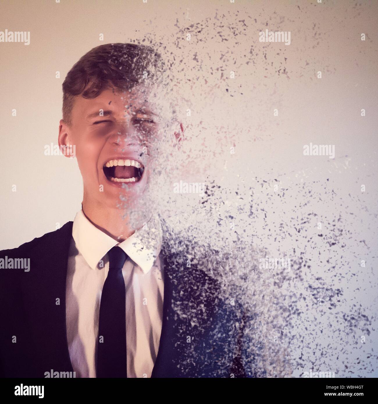 Digital Composite Image Of Young Man Dissolving Against White ...