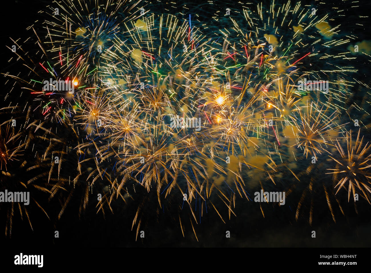 Colorful fireworks in night sky background Stock Photo - Alamy