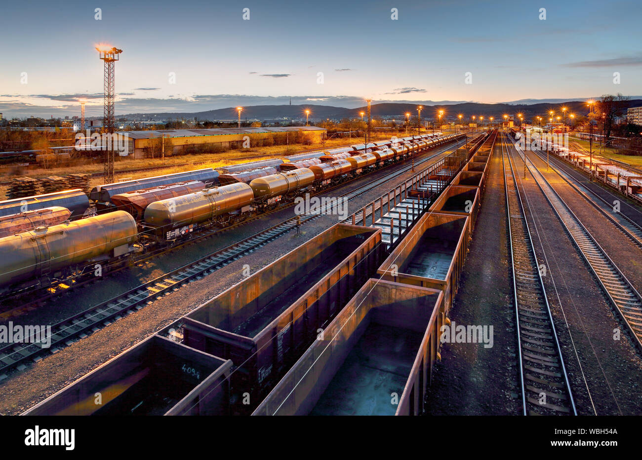 Cargo train platform at sunset with container Stock Photo - Alamy