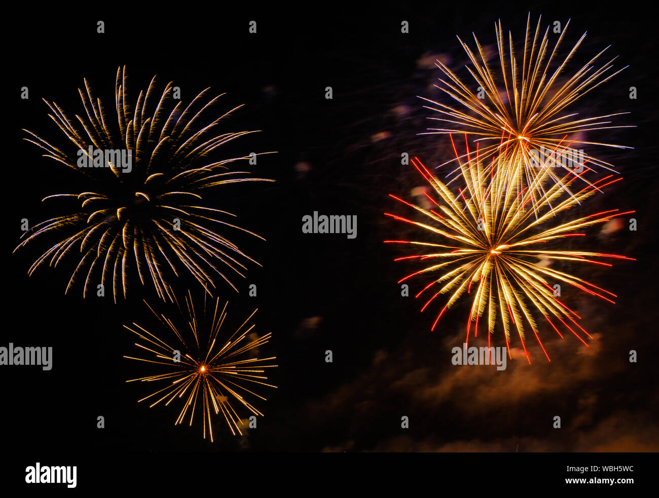 Colorful fireworks in night sky background Stock Photo - Alamy