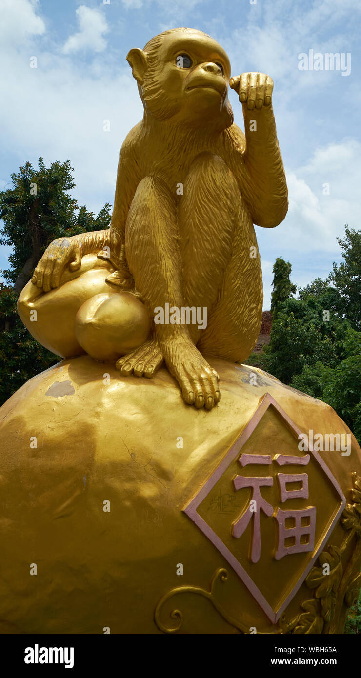 A Chinese gold monkey statue in Lopburi, Thailand. The town hosts ...