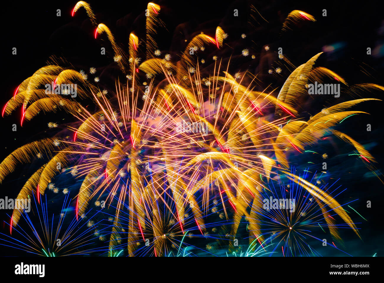 Colorful fireworks in night sky background Stock Photo - Alamy