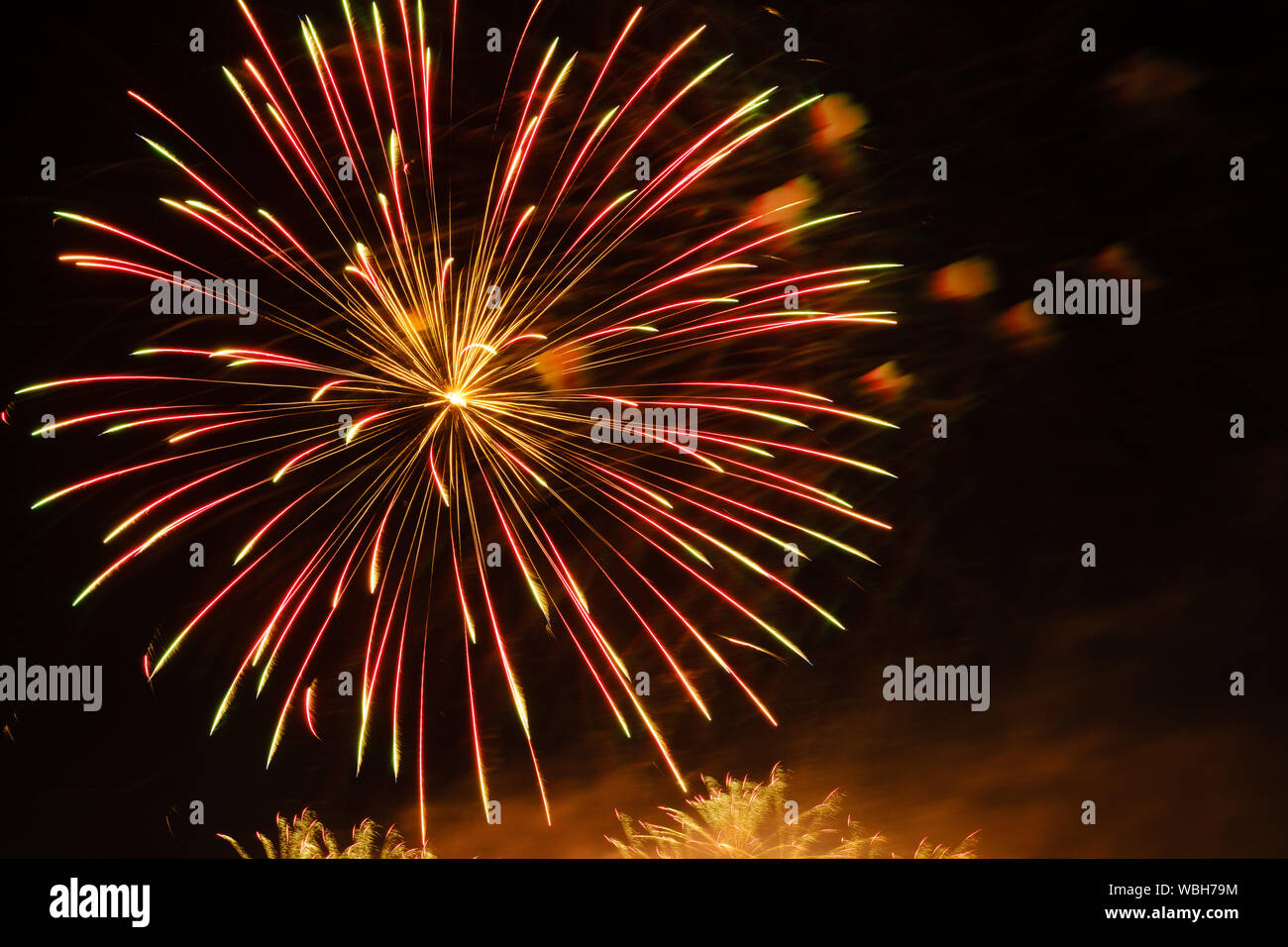 Colorful fireworks in night sky background Stock Photo - Alamy