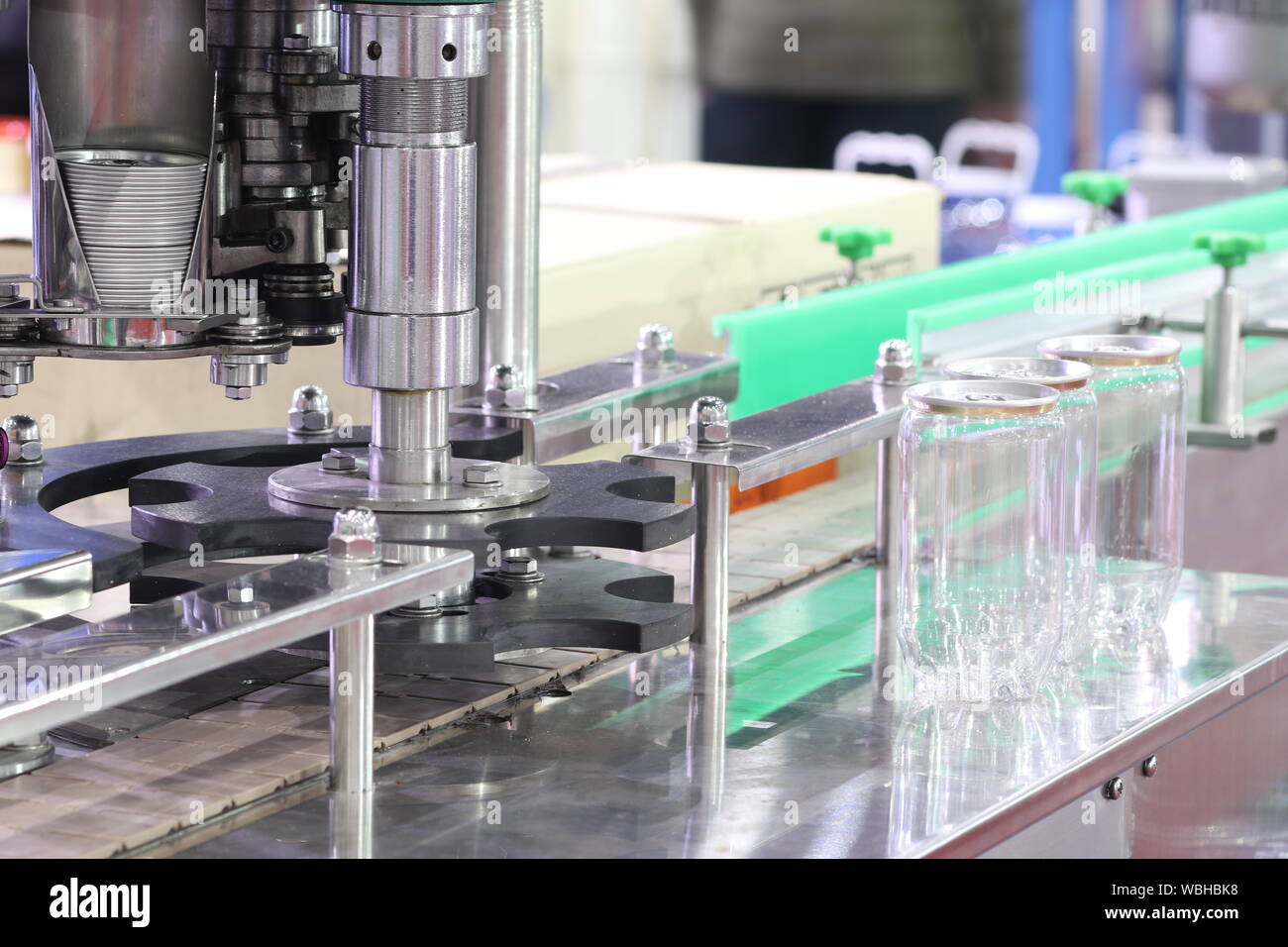 Aluminum lid packing machine for plastic can ; factory Stock Photo - Alamy