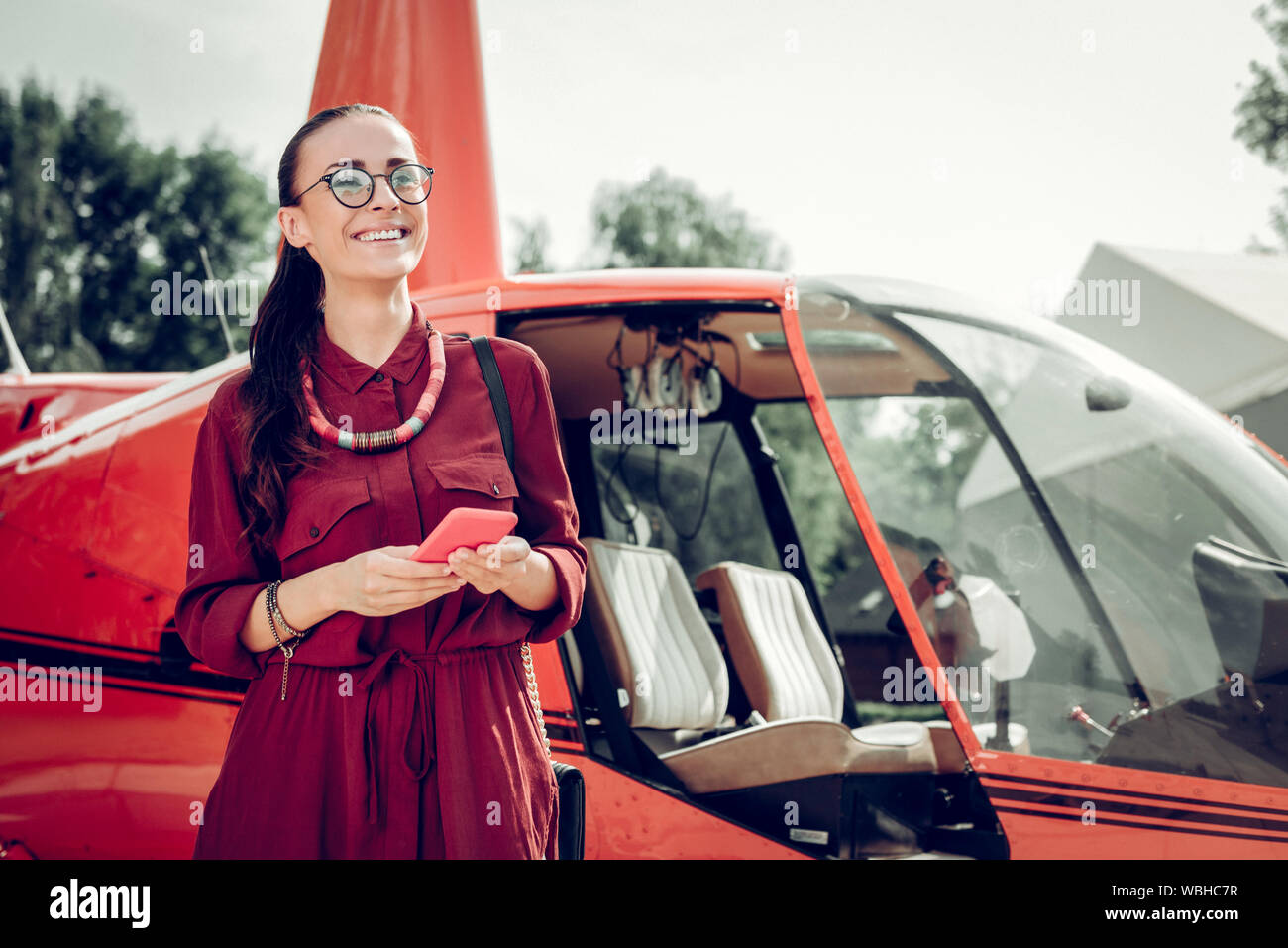 Beaming woman feeling excited before romantic date in the sky Stock ...