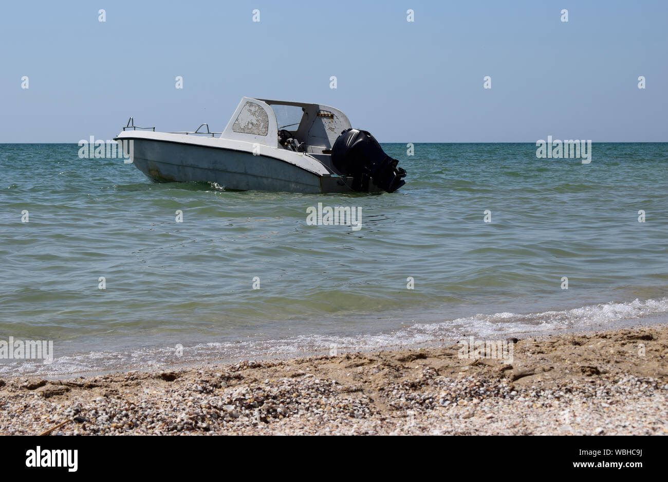 Motor boat on the background of the sea near the coast Stock Photo - Alamy