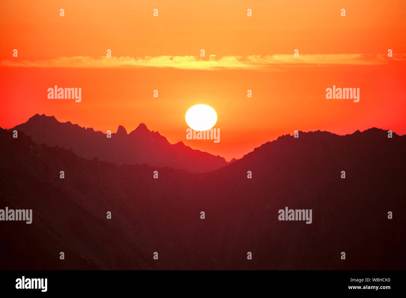 Sun over mountain ridges; beautiful colorful mountain sunset Stock ...