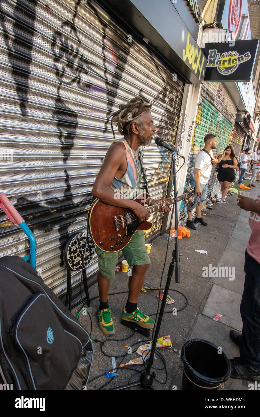 A man sings reggae music. Notting Hill Carnival 2019 continued on Bank ...