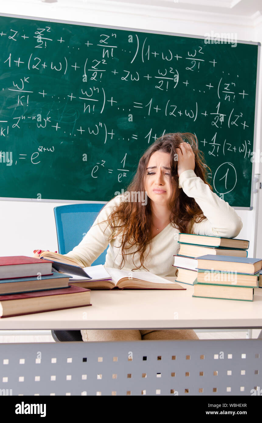 The young female math teacher in front of chalkboard Stock Photo - Alamy