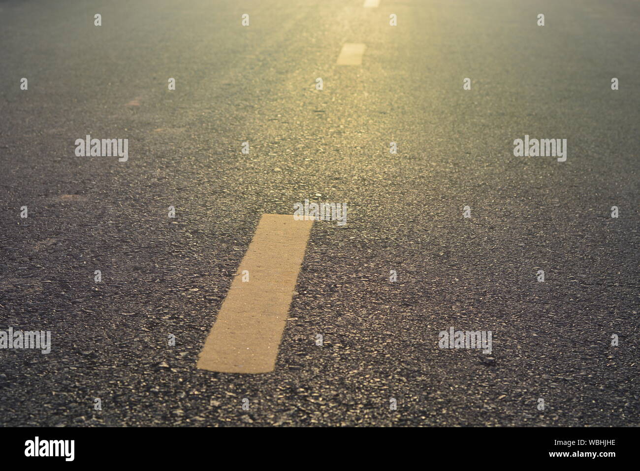 Yellow dividing line on asphalt hi-res stock photography and images - Alamy