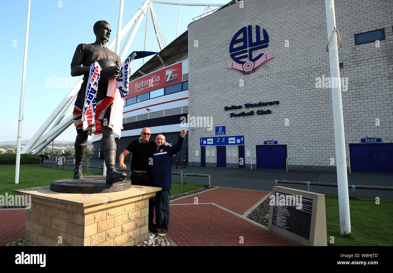 Fans near the statue Nat Lofthouse at the University of Bolton Stadium ...