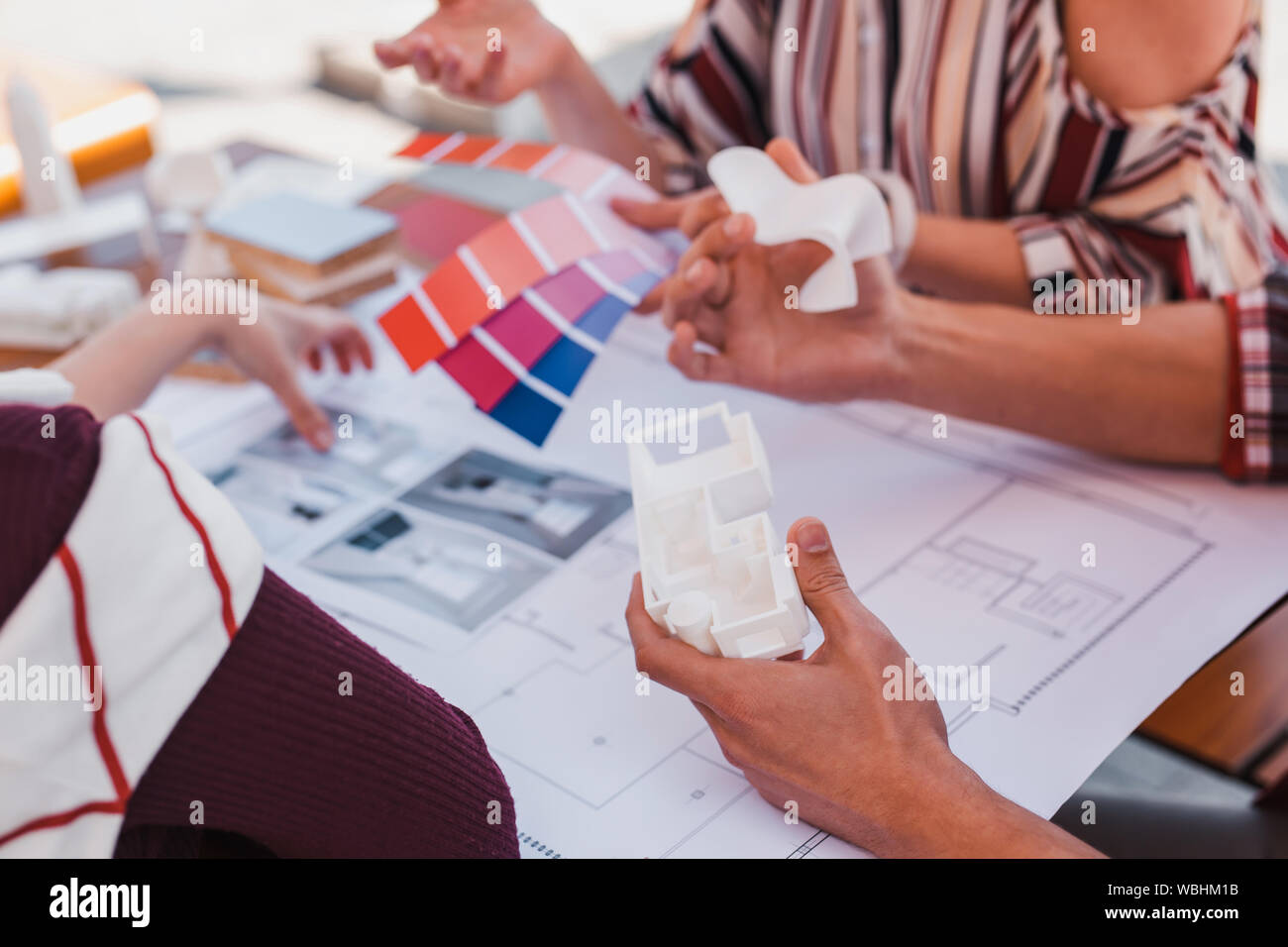 Designers working on the interior design project together Stock Photo ...
