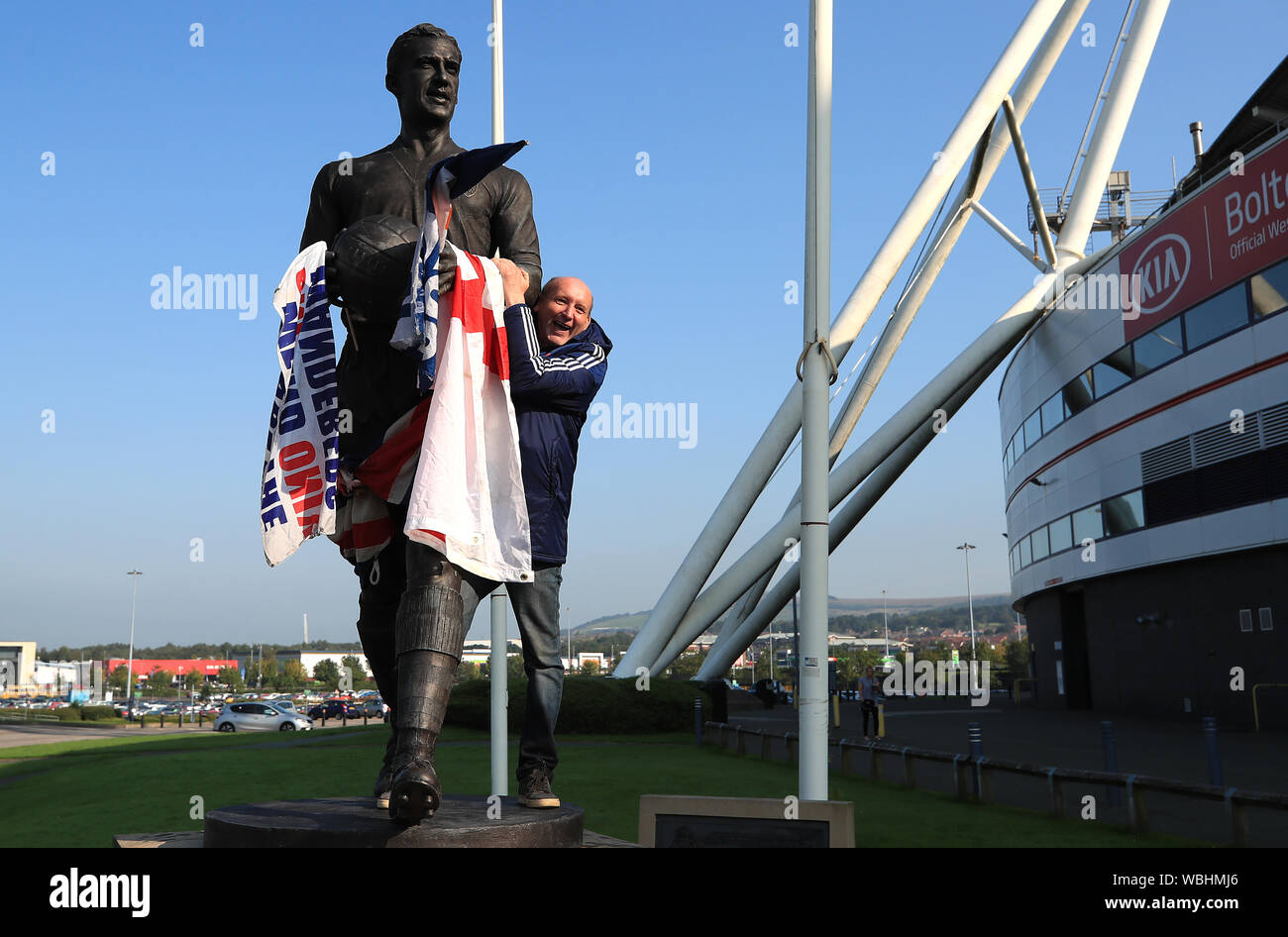 Fans interact with the statue Nat Lofthouse at the University of Bolton ...