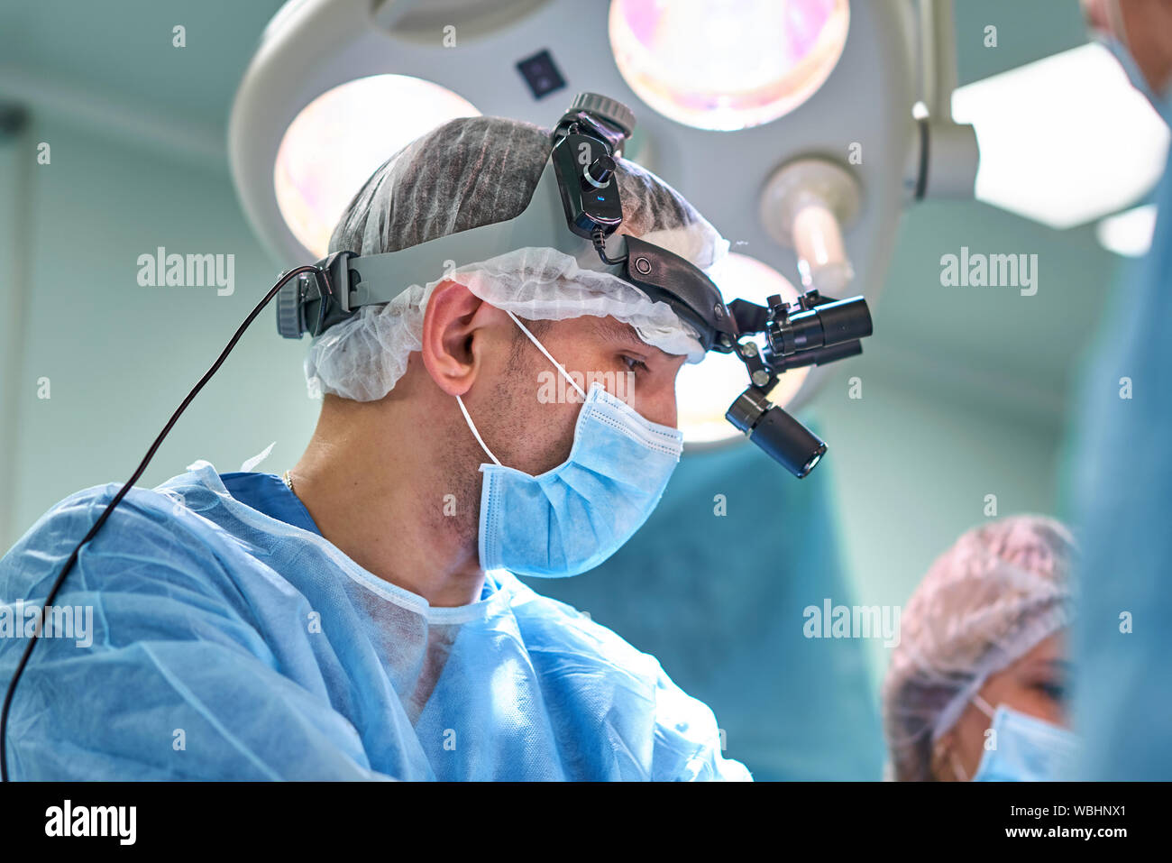 surgeons in the operating room during surgery Stock Photo - Alamy