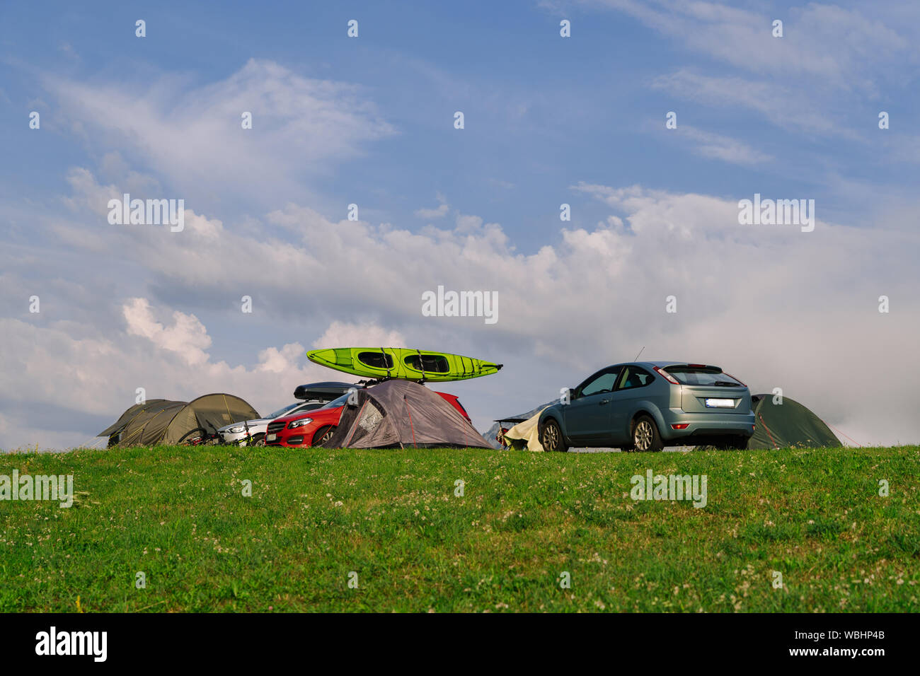 Tent camping with car and canoe on the hill in Alps region, Austria ...