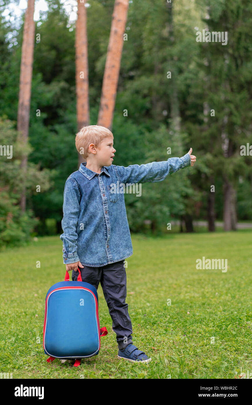 portrait of cute boy with backpack. School. First grader. Outdoor Stock ...