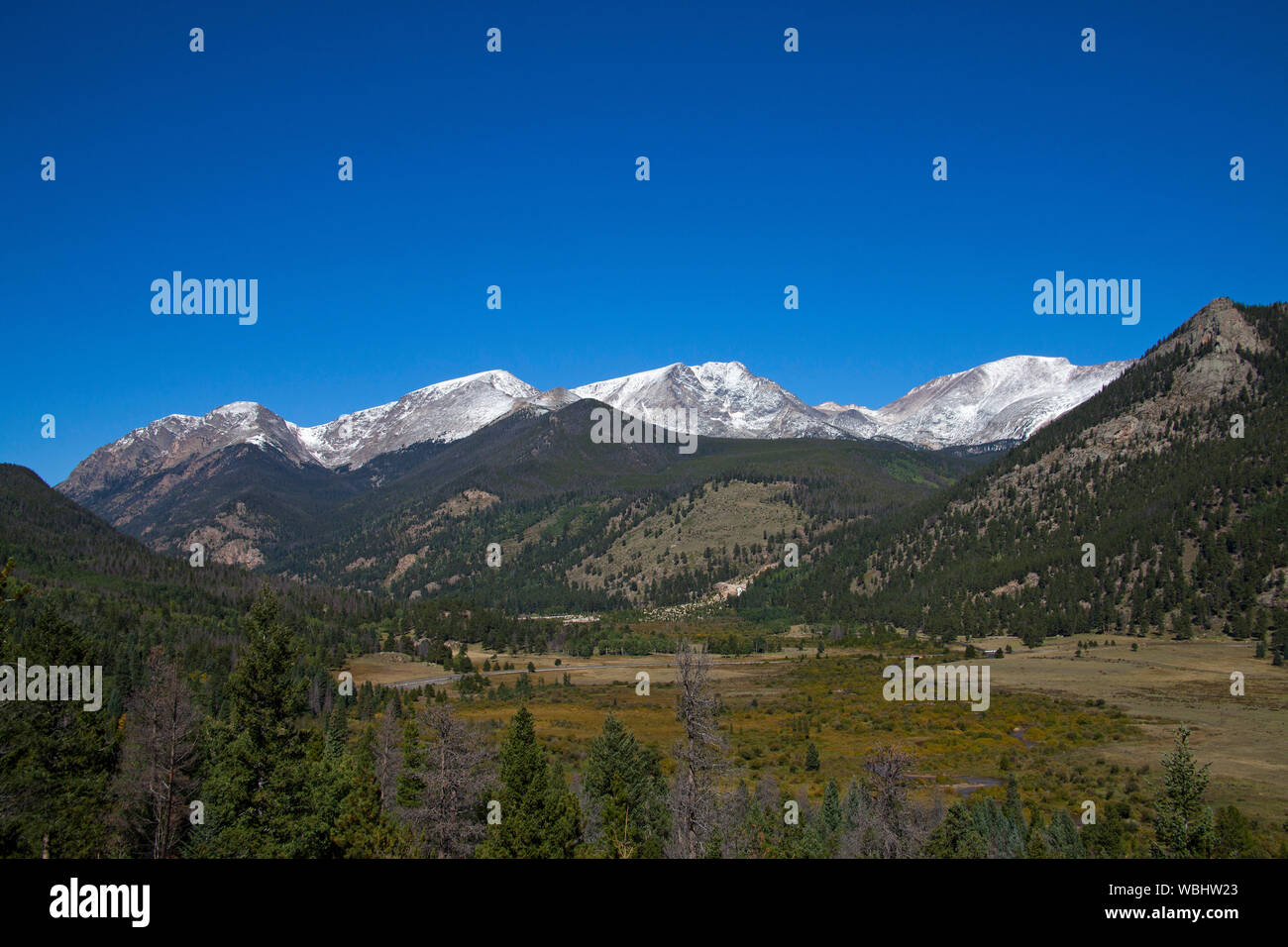 Horseshoe Park with snow covered mountains in the Mummy Range beyond ...