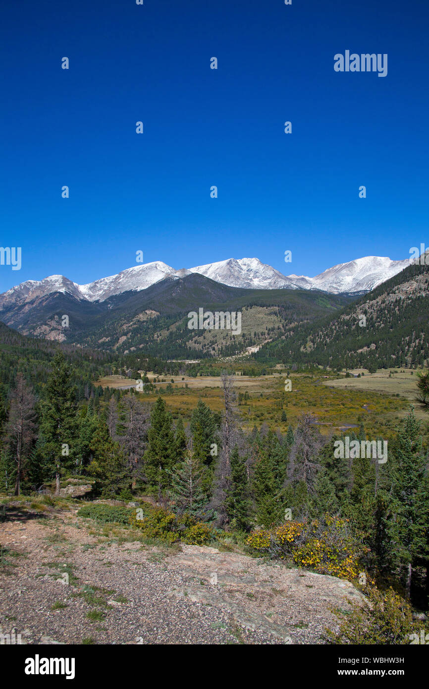 Horseshoe Park with snow covered mountains in the Mummy Range beyond ...