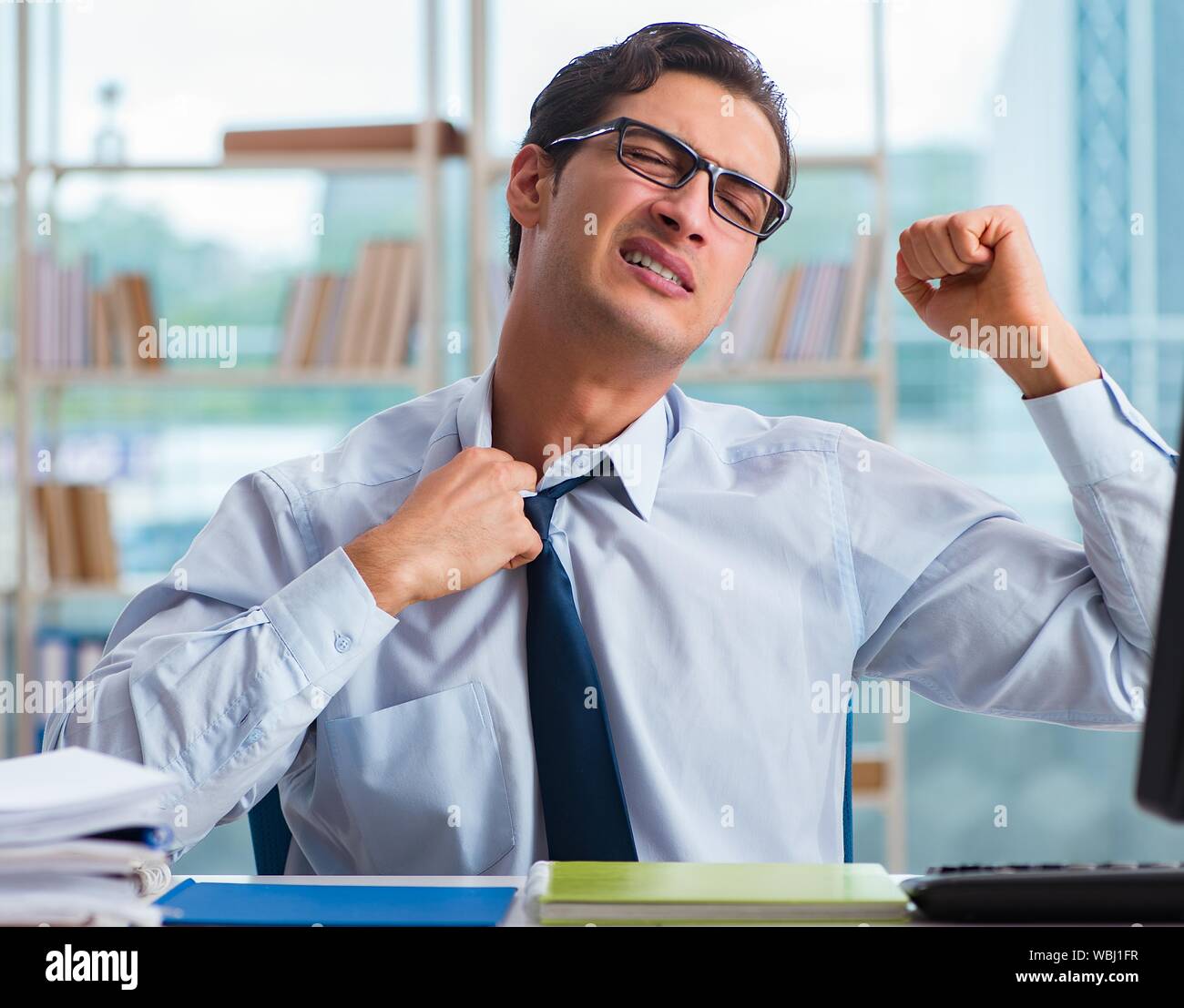 The businessman suffering from excessive armpit sweating Stock Photo ...