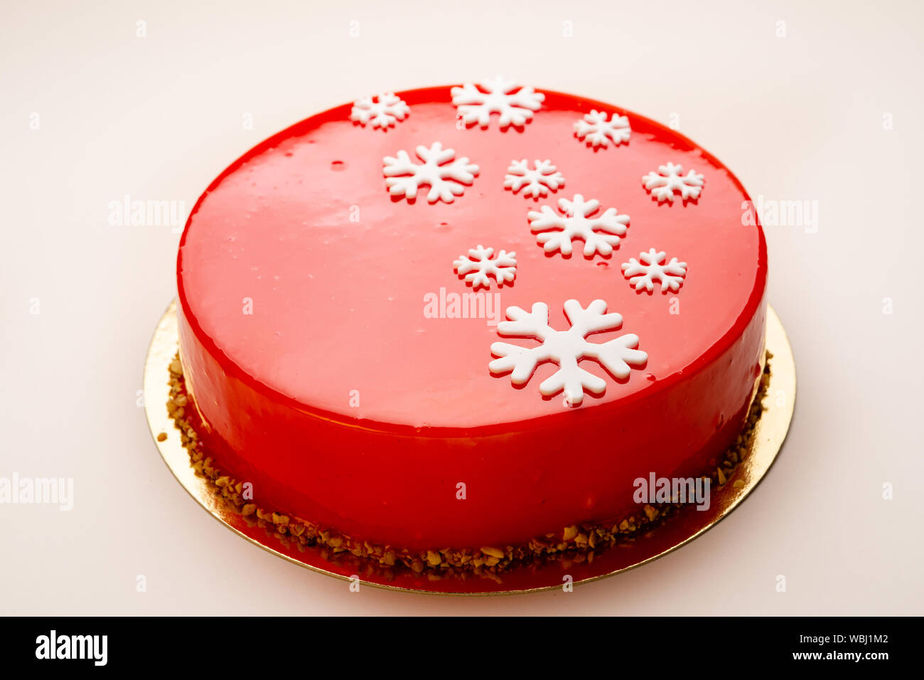 Red mousse cake with white snowflakes Stock Photo - Alamy