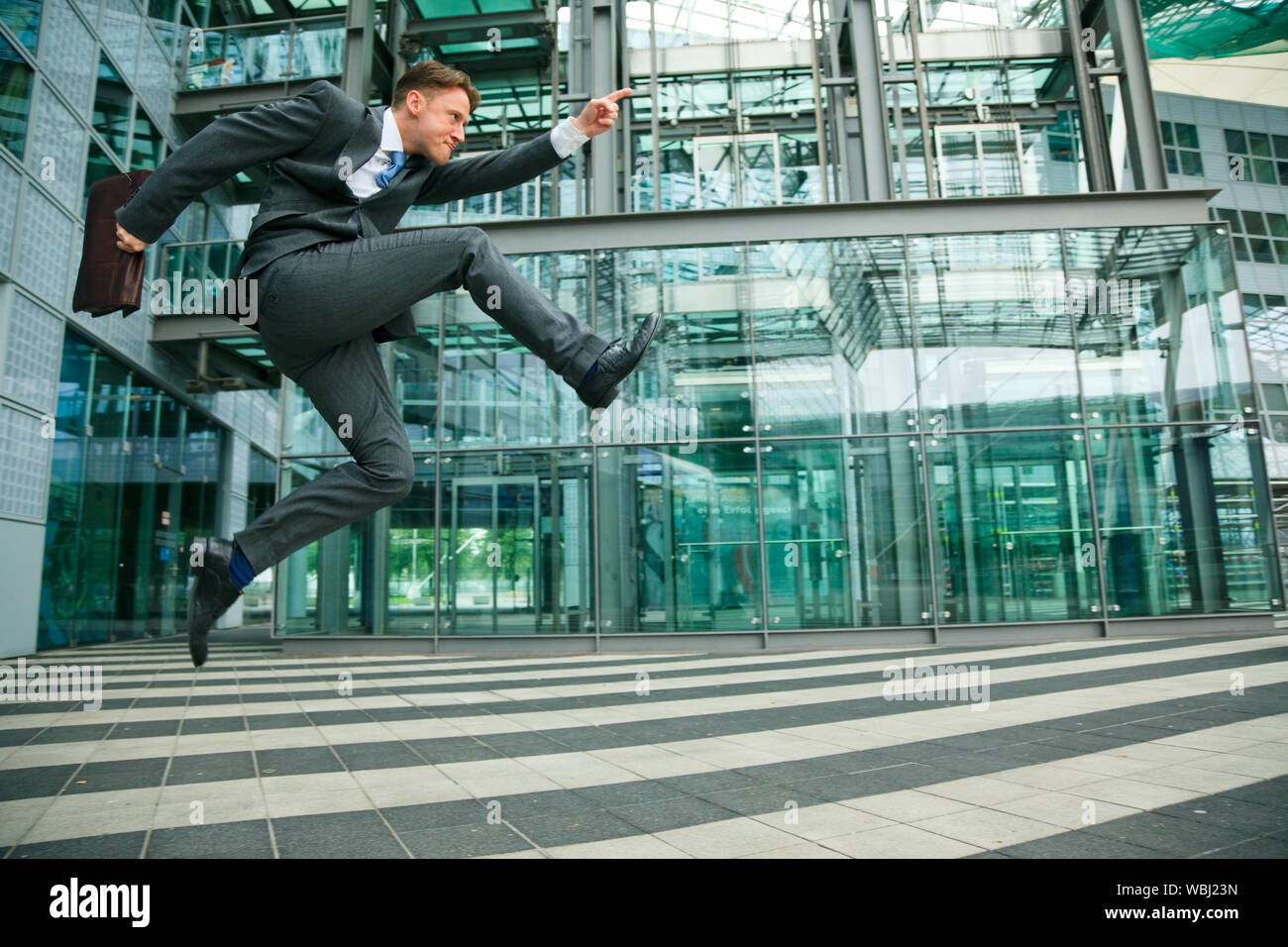 Businessman jumping hi-res stock photography and images - Alamy