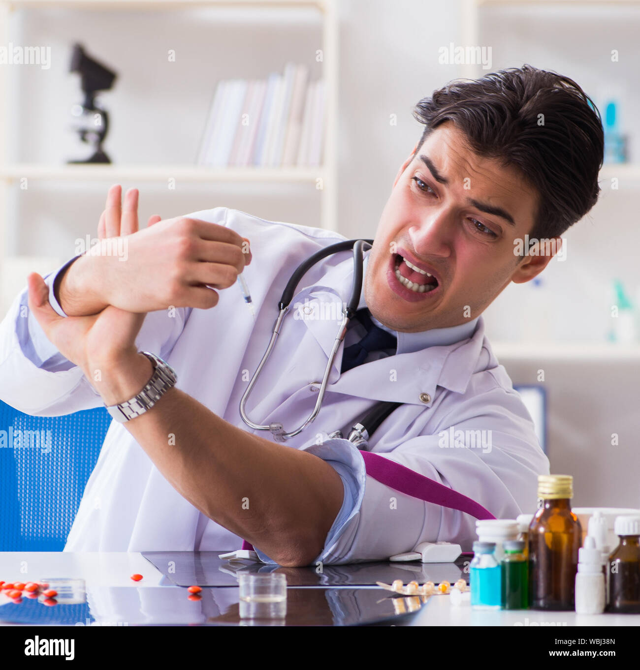 The doctor drug addict in the hospital Stock Photo - Alamy