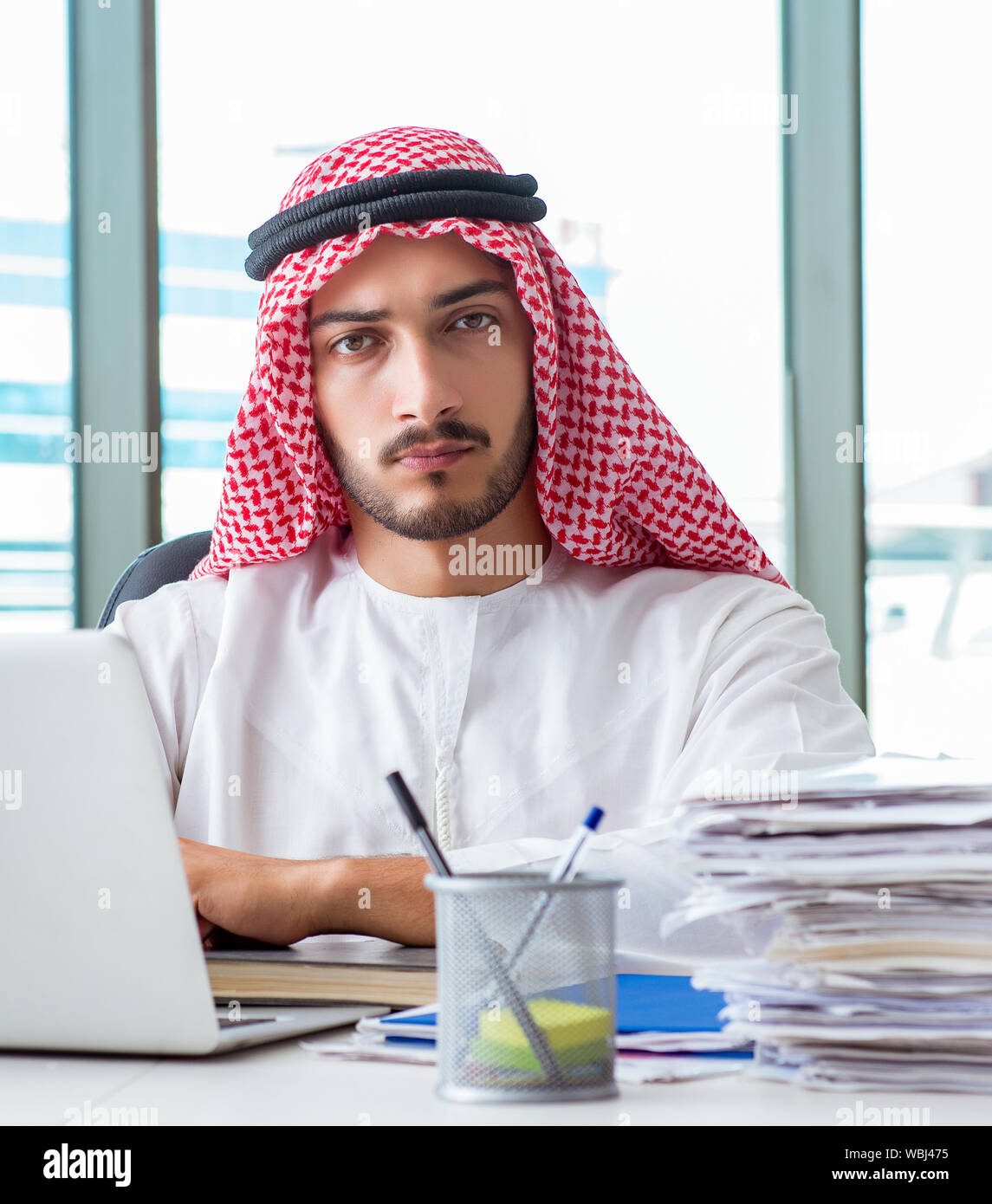 The arab businessman working in the office Stock Photo - Alamy