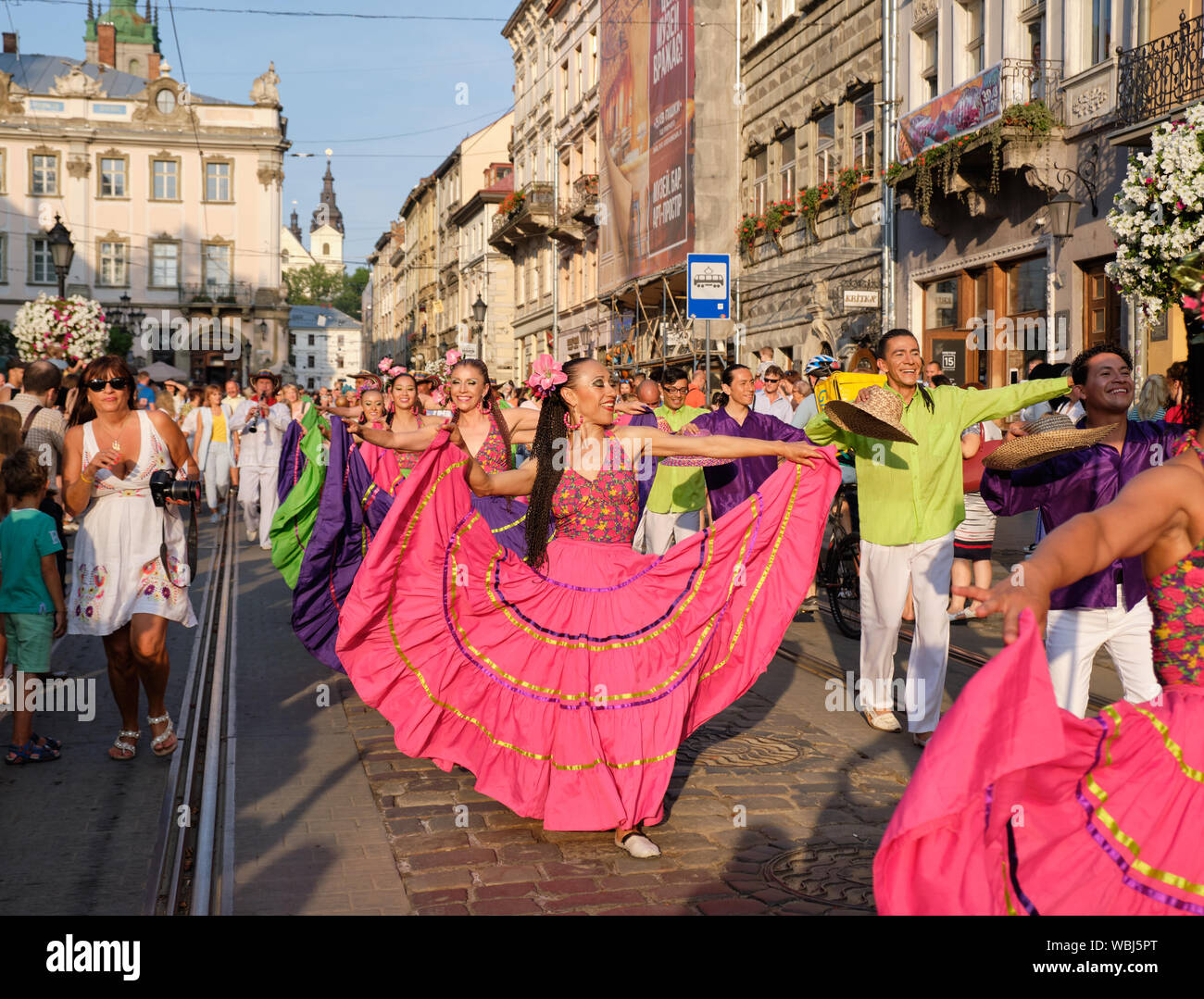 Colombian Folklore group dancing down streets to the joy of crowd ...