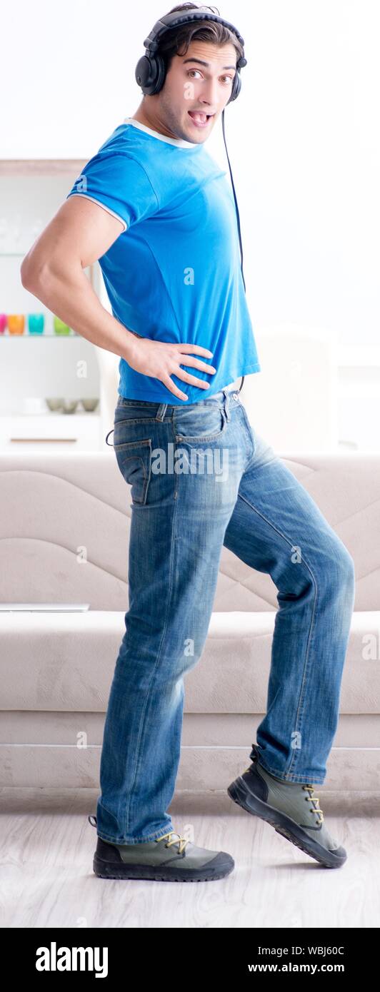 The young man singing at home karaoke Stock Photo - Alamy