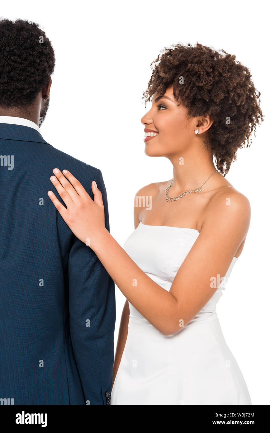 back view of african american bridegroom standing near happy bride ...