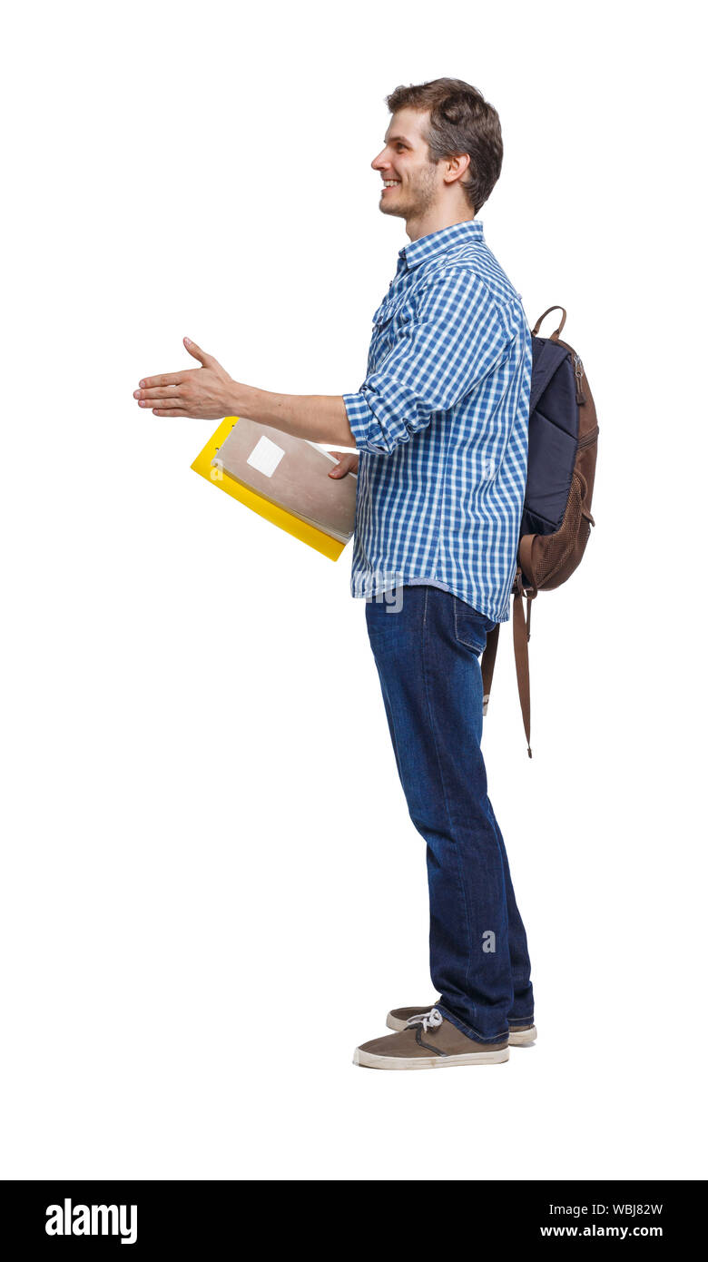 Side view of student man with the backpack and textbookswho stretches ...