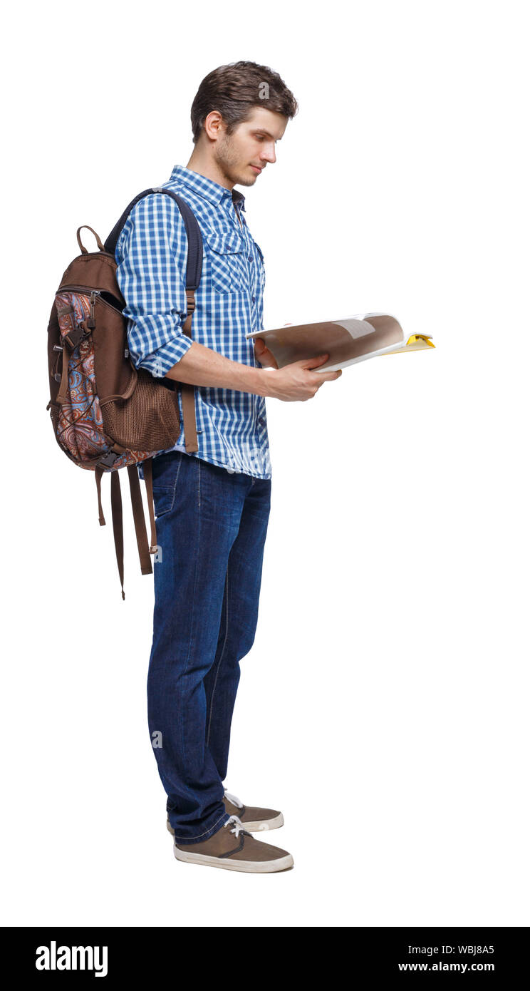 Side view of a student. guy with the backpack and textbooks. Rear view ...