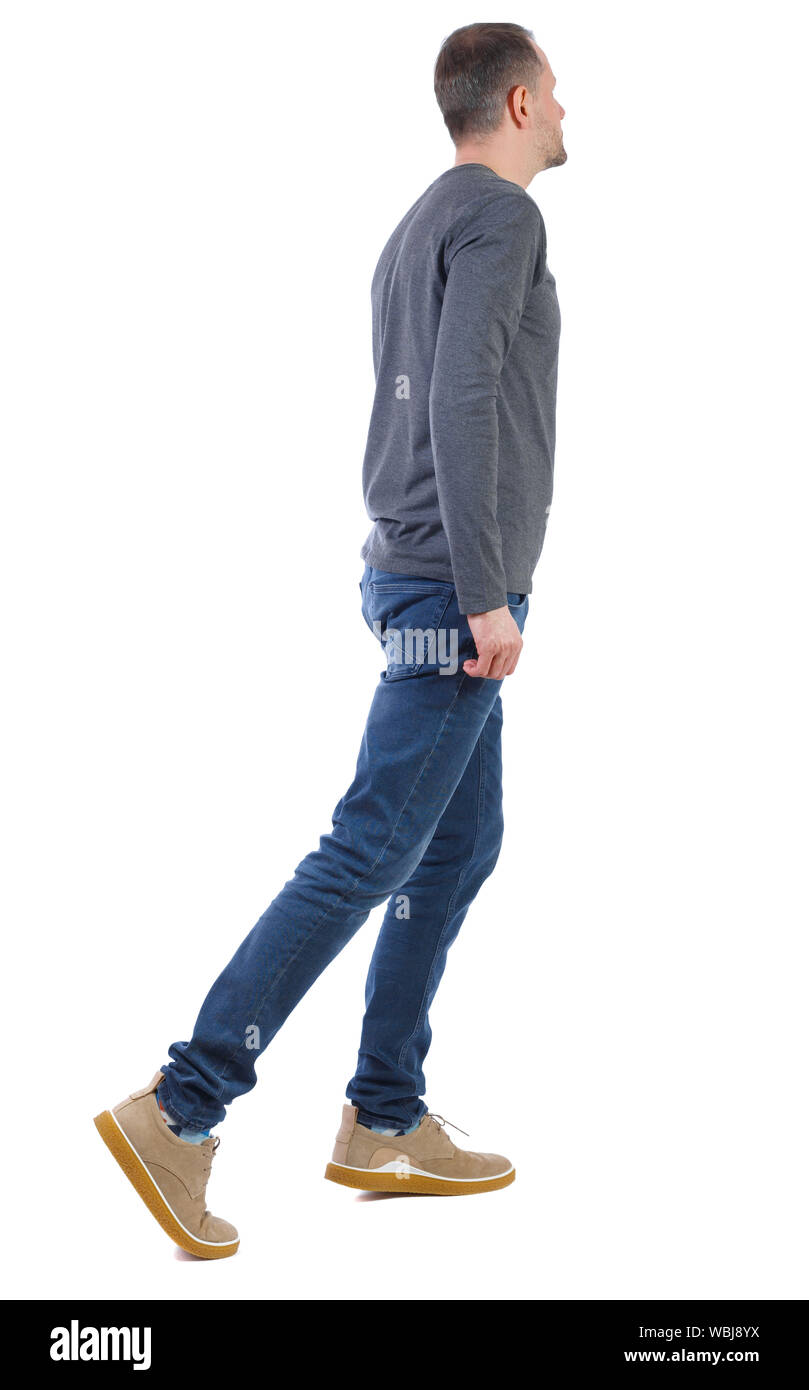 Side view of going handsome man. walking young guy . Rear view people ...