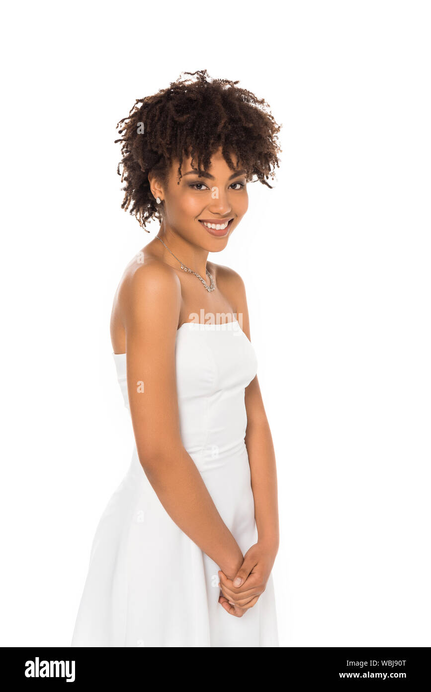 happy african american bride standing in wedding dress isolated on ...