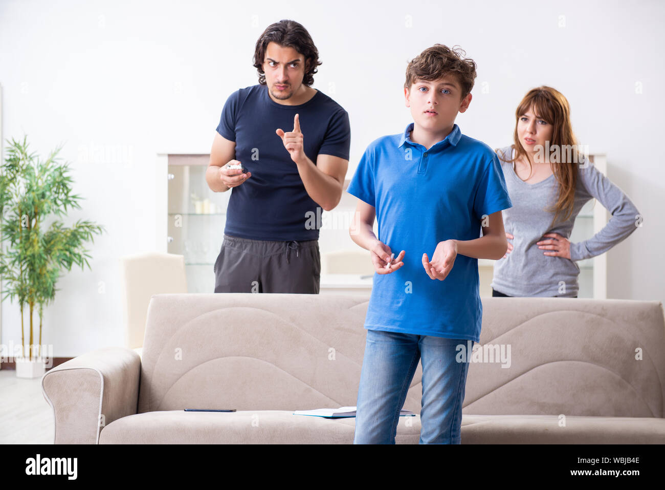 The concept of underage smoking with young boy and family Stock Photo ...