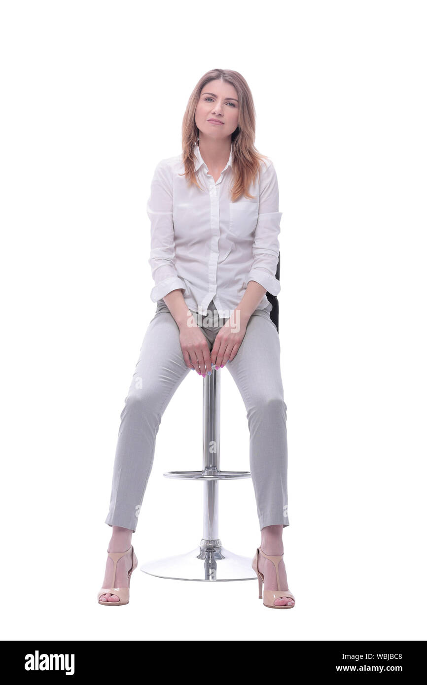 confident modern woman sitting on a chair . isolated on white ...