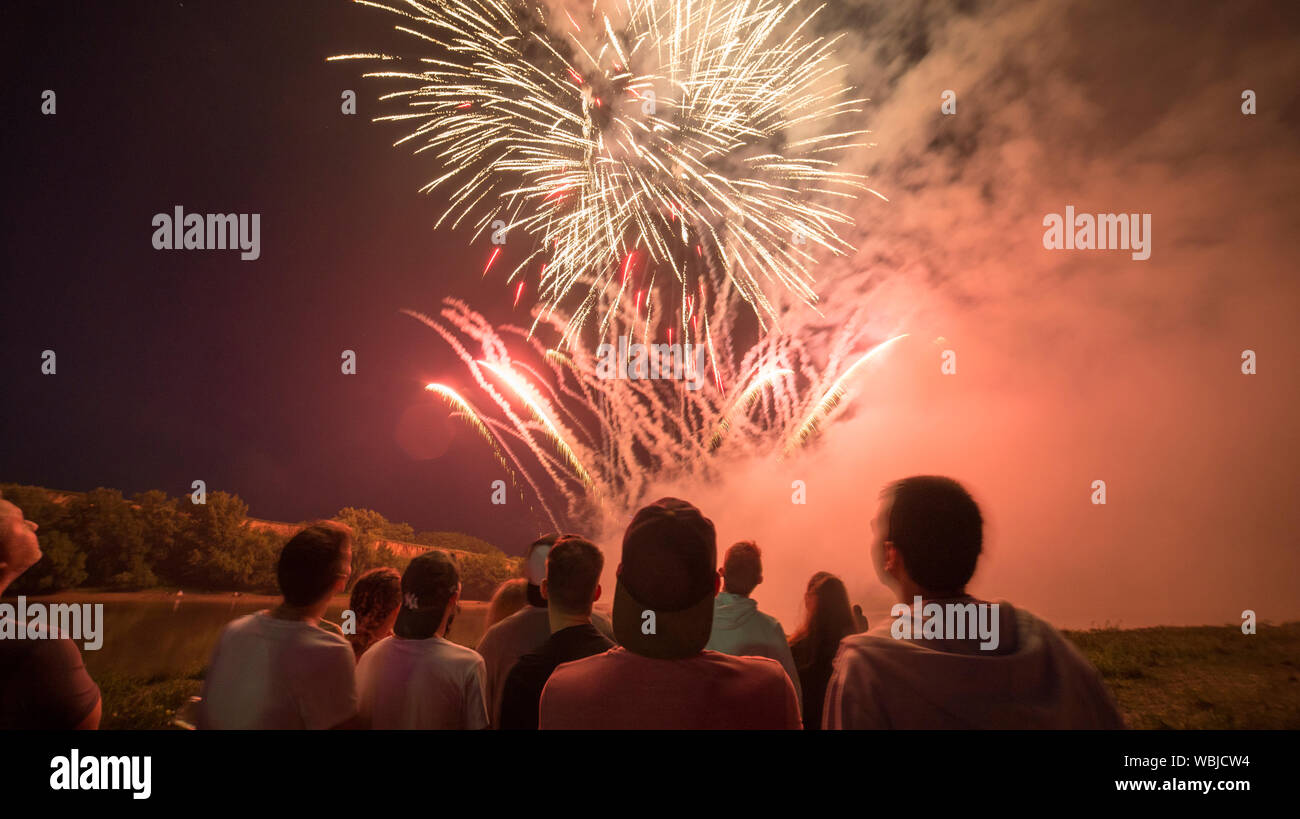 People celebrating with fireworks in the sky Stock Photo - Alamy