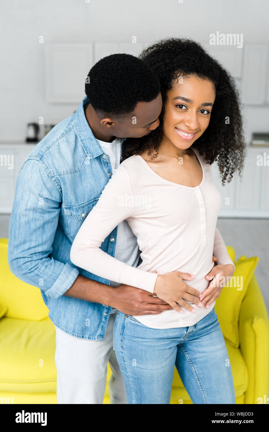 Happy couple cuddling african american hi-res stock photography and ...