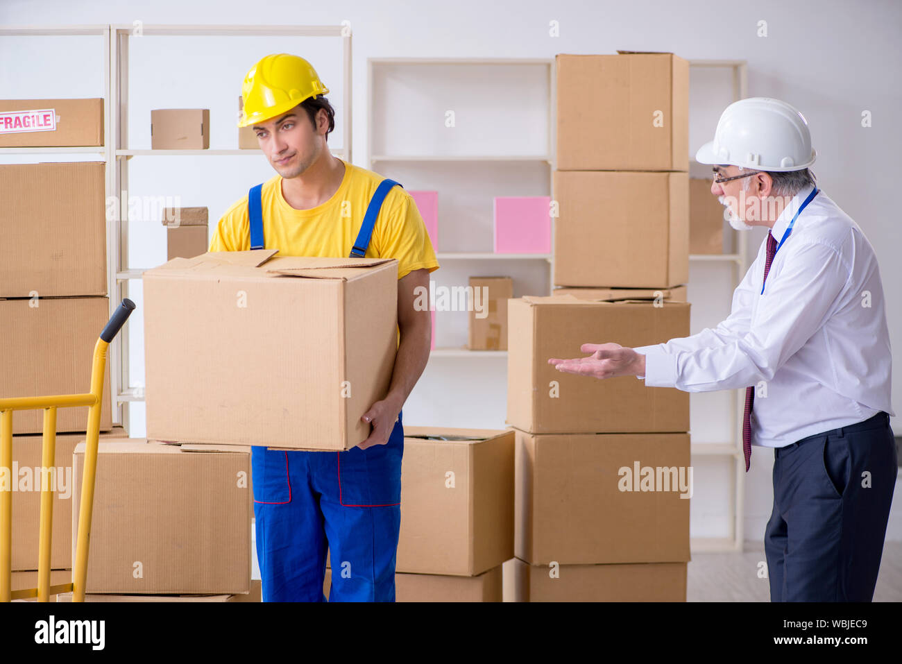 The professional movers doing home relocation Stock Photo - Alamy