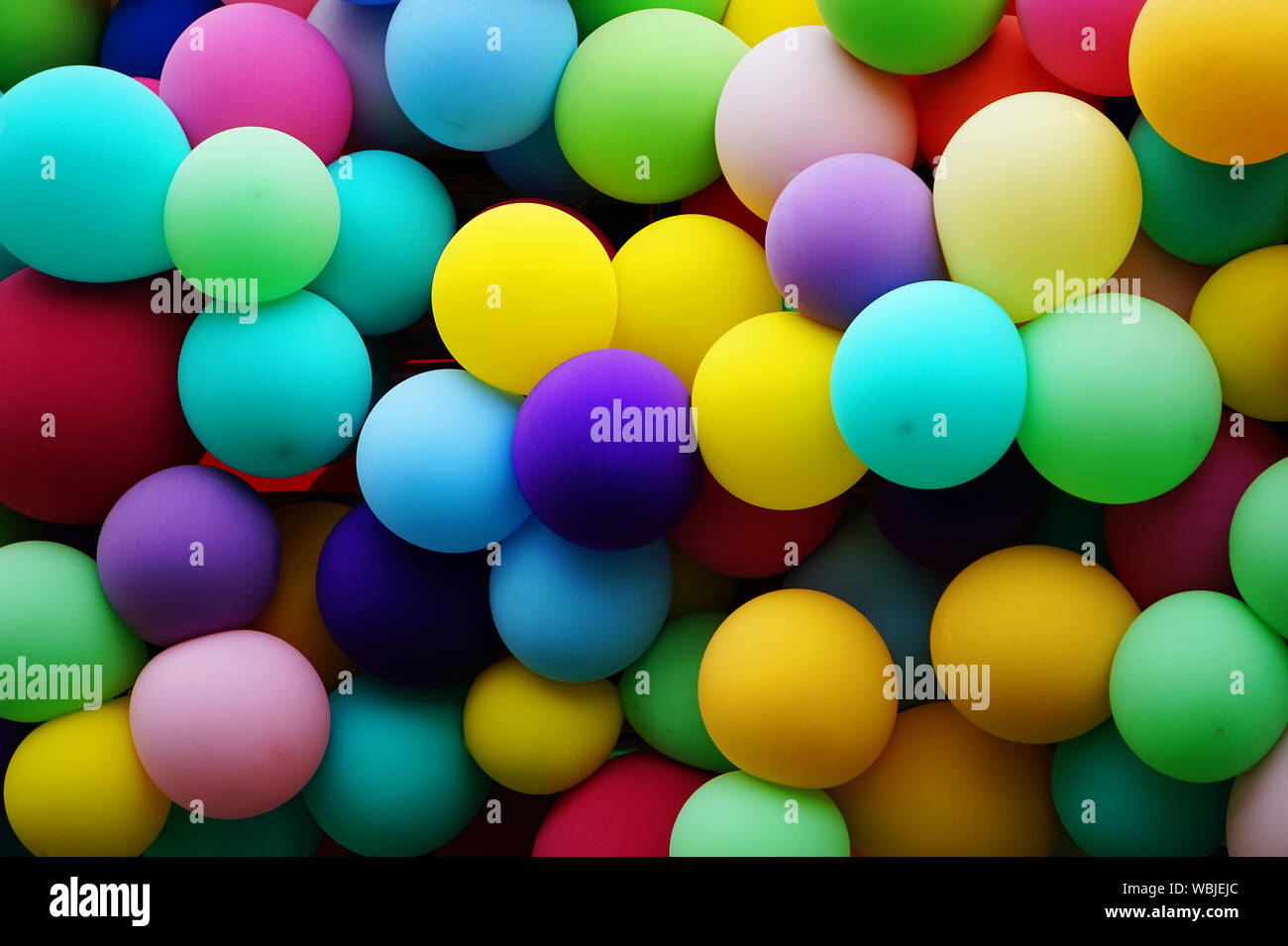 Bright balloons of different sizes and colors Stock Photo - Alamy