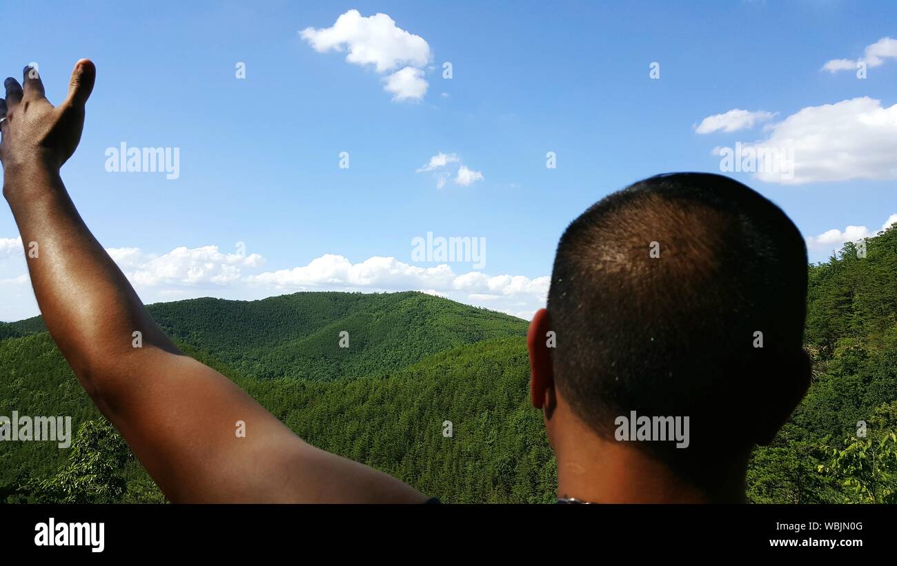 Man with hand raised hi-res stock photography and images - Alamy