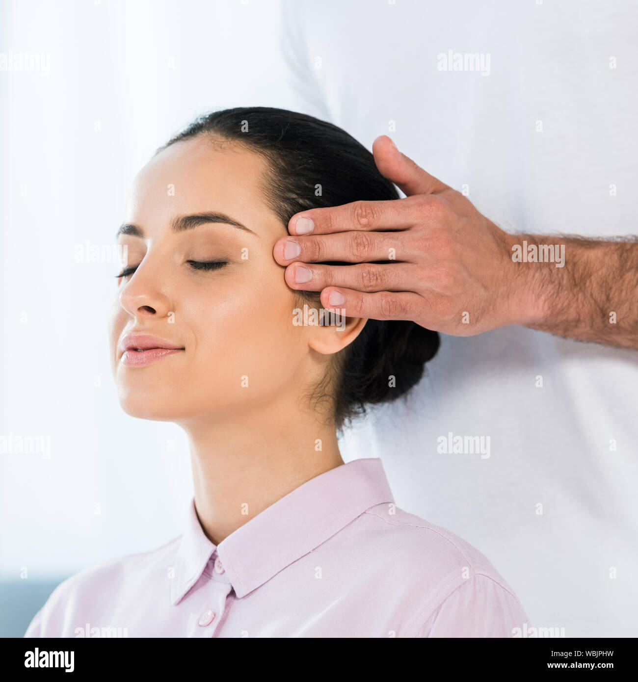 Hands on temples hi-res stock photography and images - Alamy