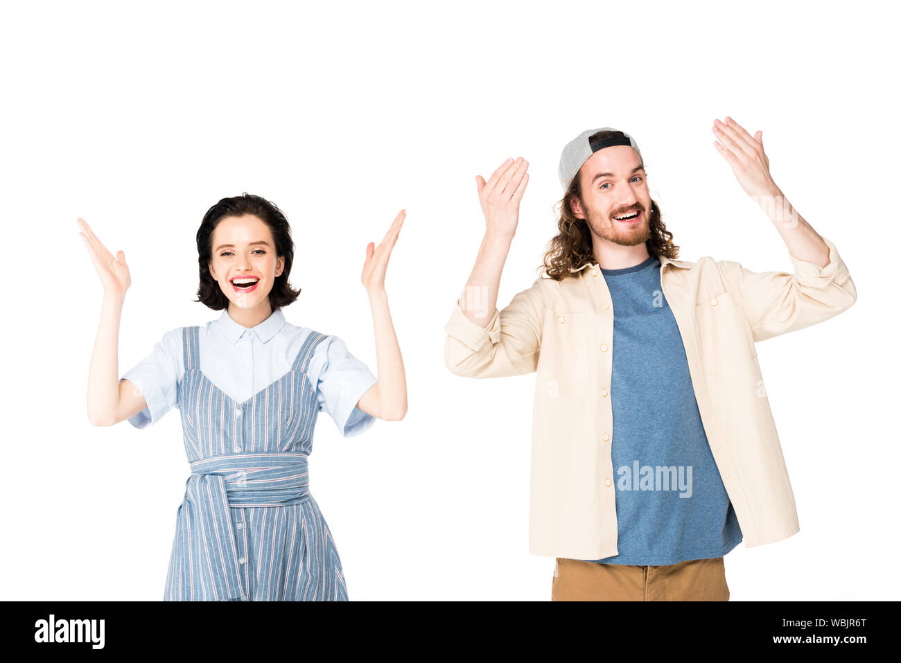 two people raising hands in air and smiling isolated on white Stock ...